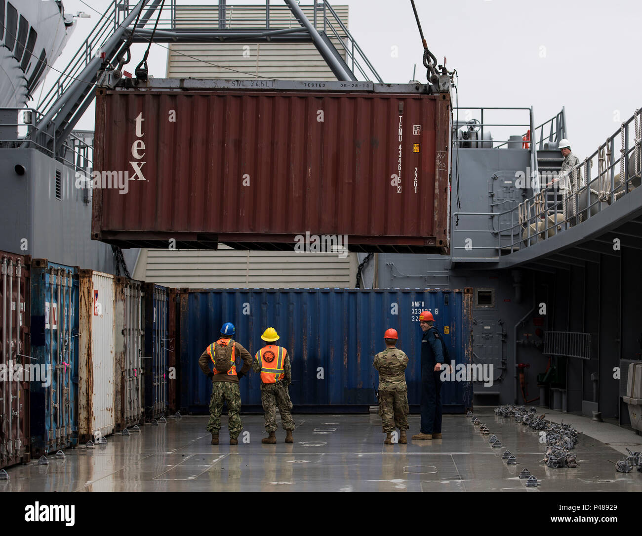 U.S. Navy sailors assigned to Navy Cargo Handling Battalion 1, from San ...