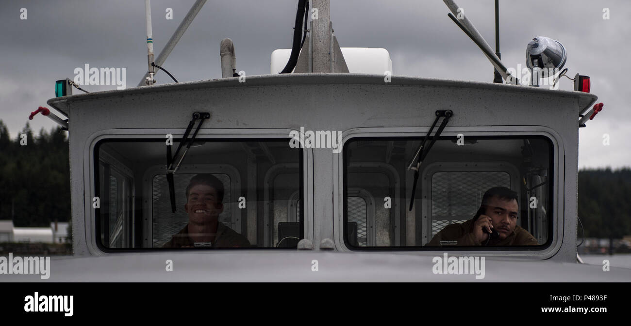 U.S. Navy sailors assigned to Assault Craft Unit Utility Boat 13, drive ...