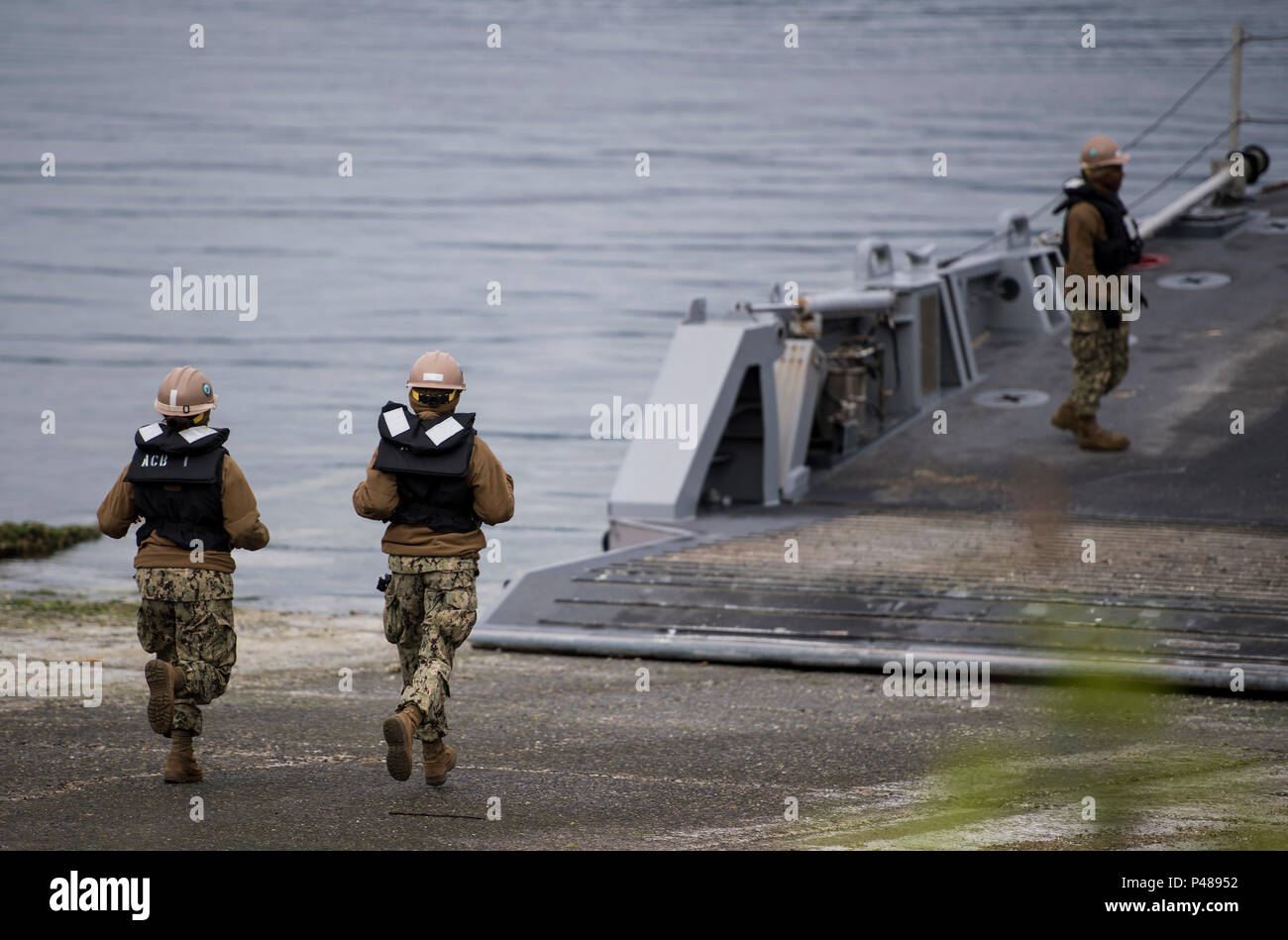U.S. Navy Boatswains Mates assigned to Beach Master Unit 1, from San ...