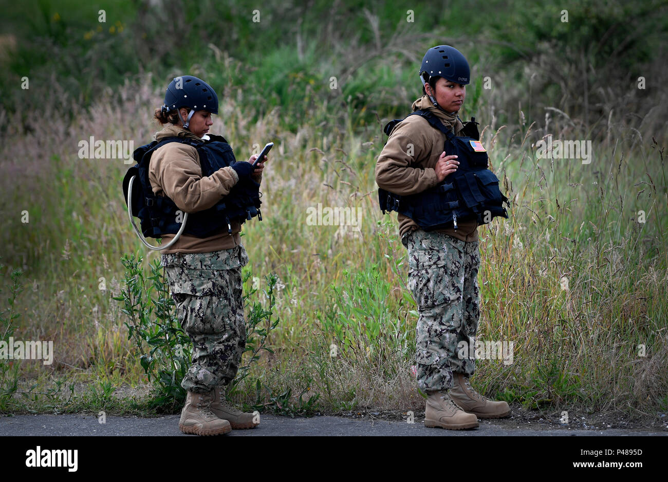 U.S. Navy Boatswains Mates assigned to Beach Master Unit 1, from San ...