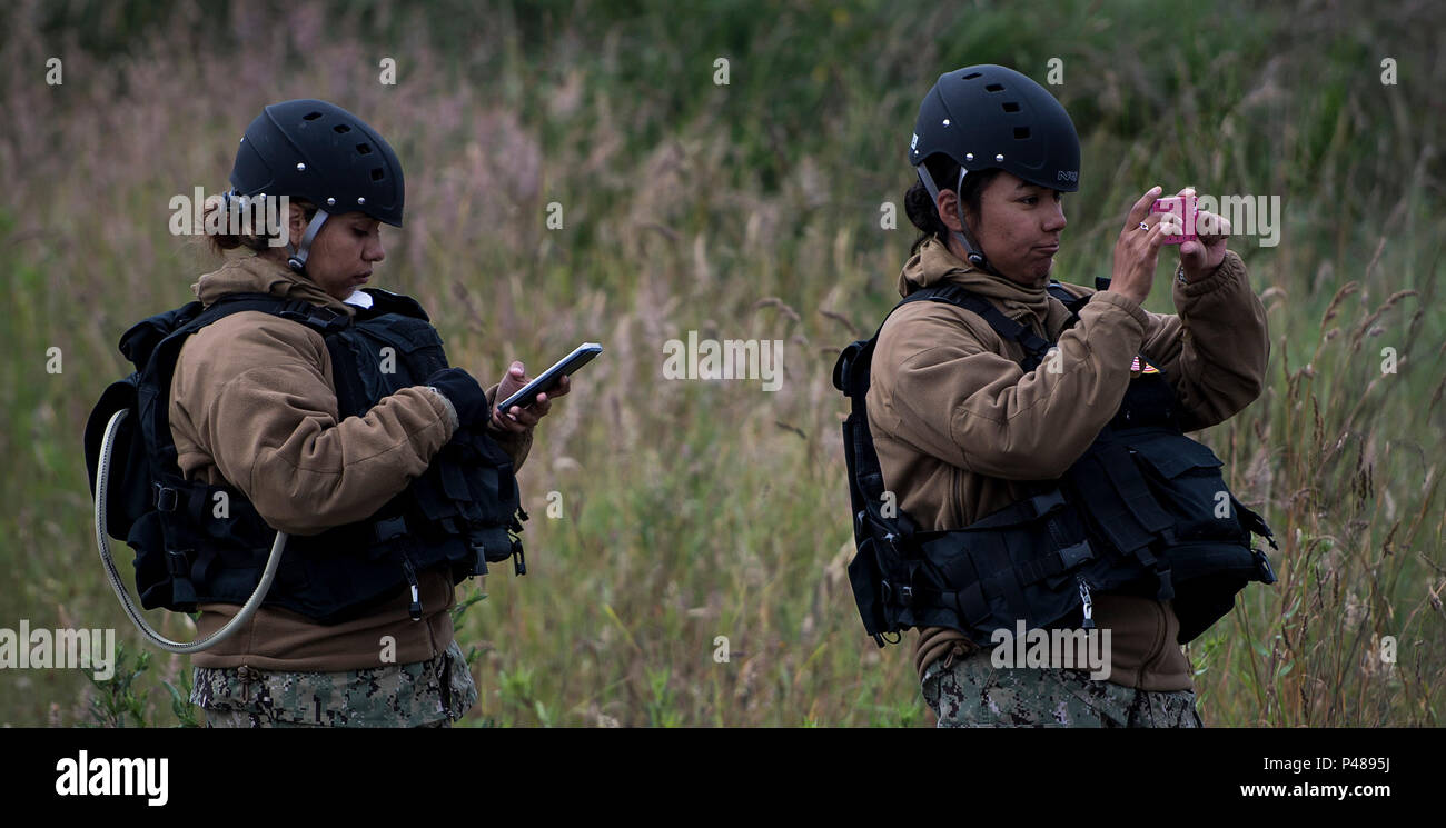 U.S. Navy Boatswains Mates assigned to Beach Master Unit 1, from San ...