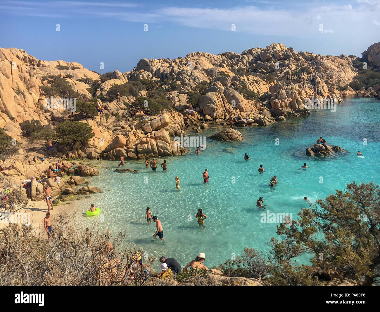 Caprera, Italy - September 8, 2017: Beach life with people sitting on ...