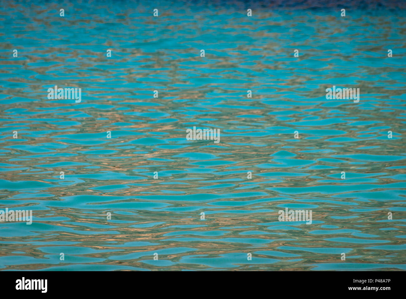 Texture of blue ocean water with reflections Stock Photo - Alamy