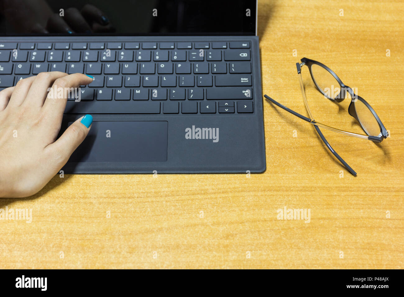 Businesswoman hands working on modern laptop computer on workspace with ...
