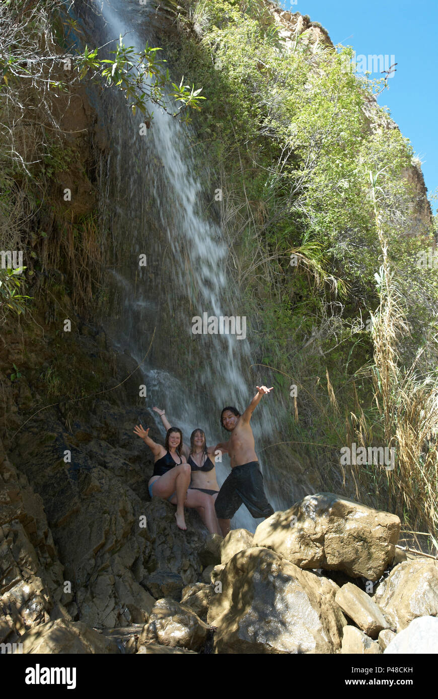Bathing under a waterfall in the Peruvian Andes near Choquequirao Stock ...