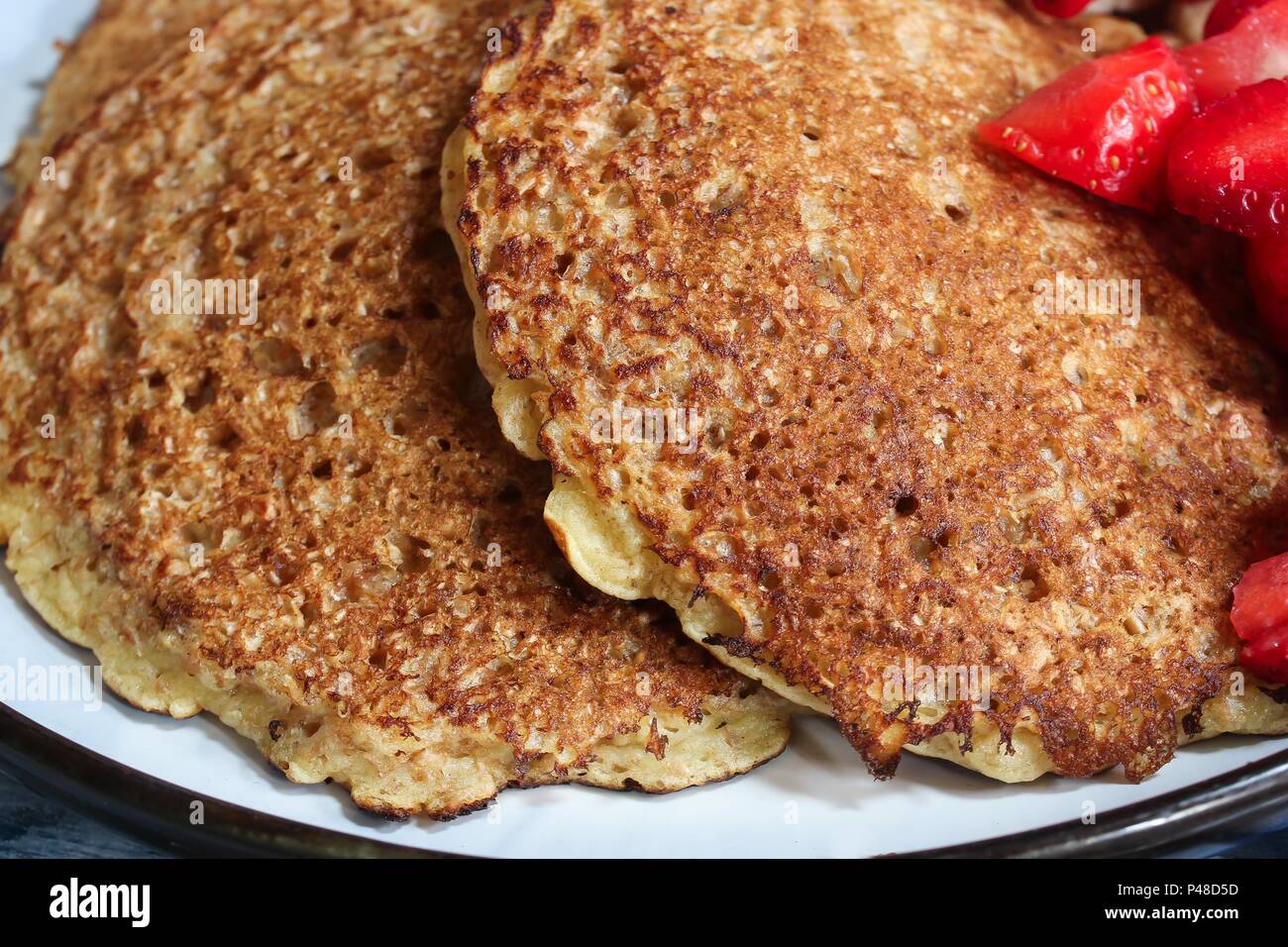 Homemade Oat wheat Bran Pancakes served with fresh strawberries and ...