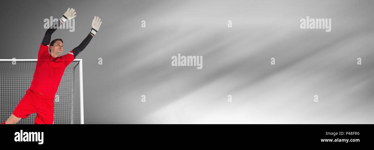 Soccer goalkeeper saving in goal with transition Stock Photo - Alamy