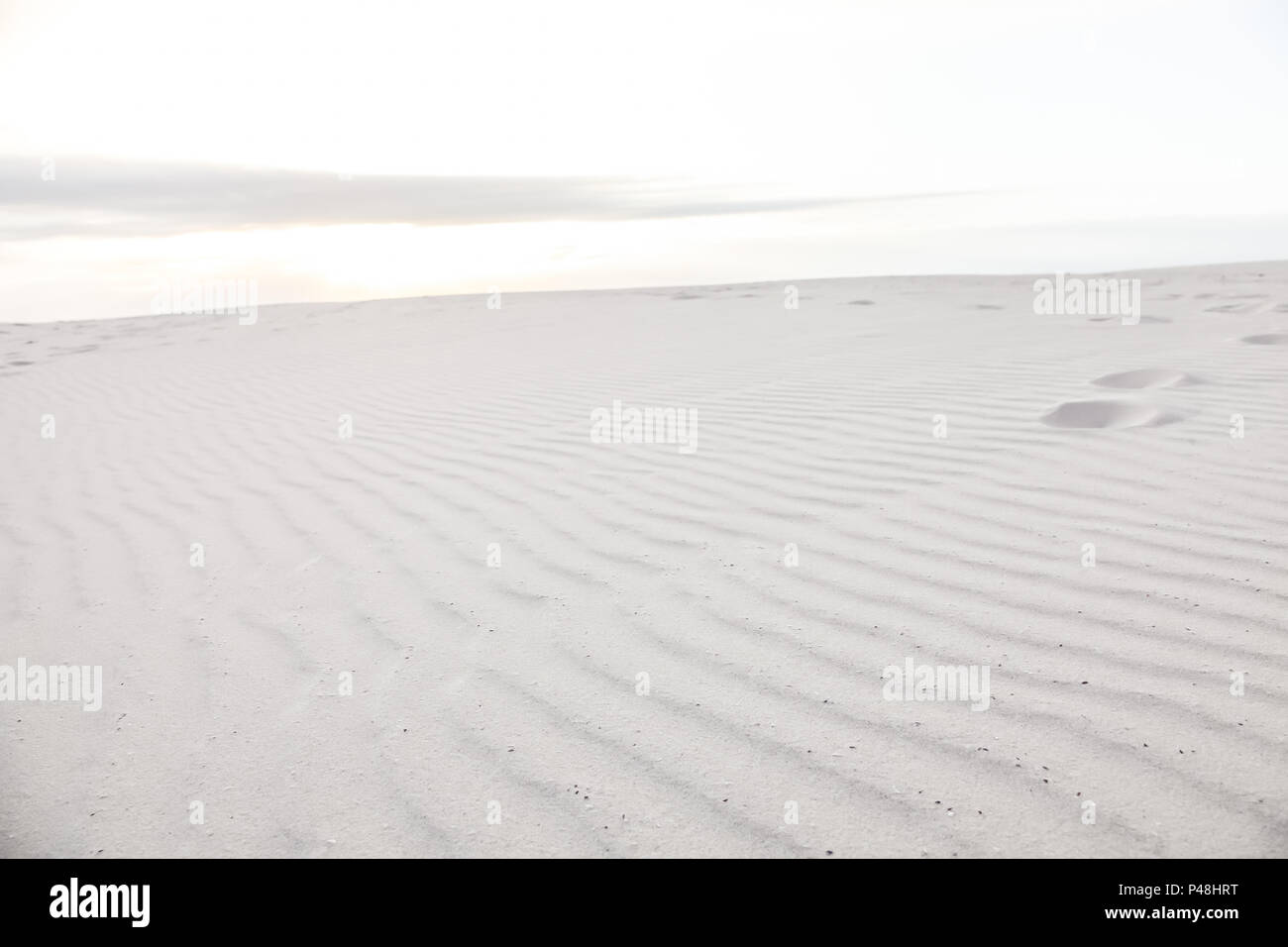 Coastal white beach sand with ripples and waves texture pattern for ...