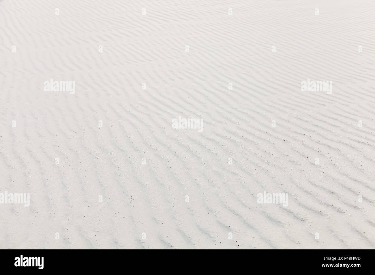 Coastal white beach sand with ripples and waves texture pattern for ...