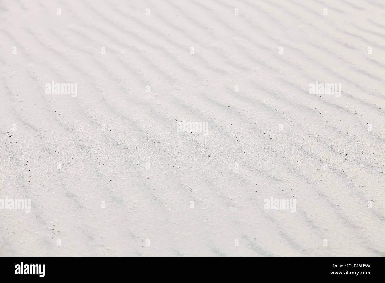 Coastal white beach sand with ripples and waves texture pattern for ...