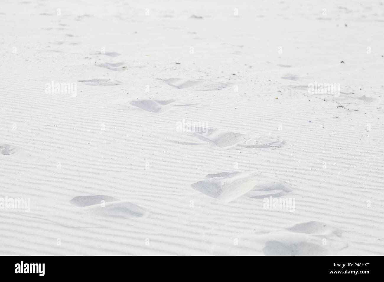 Coastal white beach sand with ripples and waves texture pattern for ...