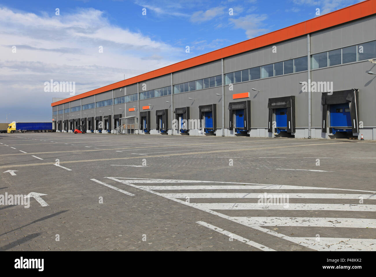 Cargo Dock Ramps for Loading Trucks at Long Distribution Warehouse ...