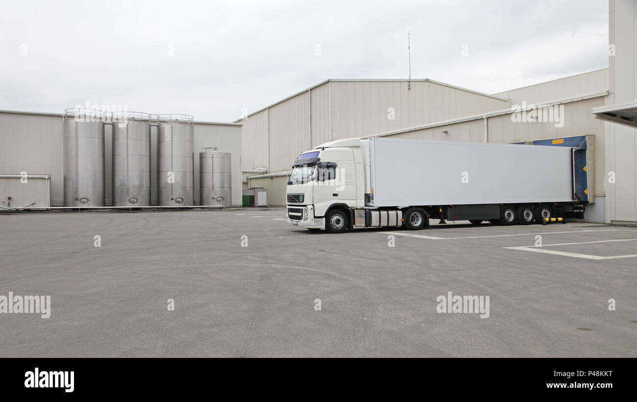 Semi Truck Trailer and Steel Silo Storage Tanks Warehouse Stock Photo ...