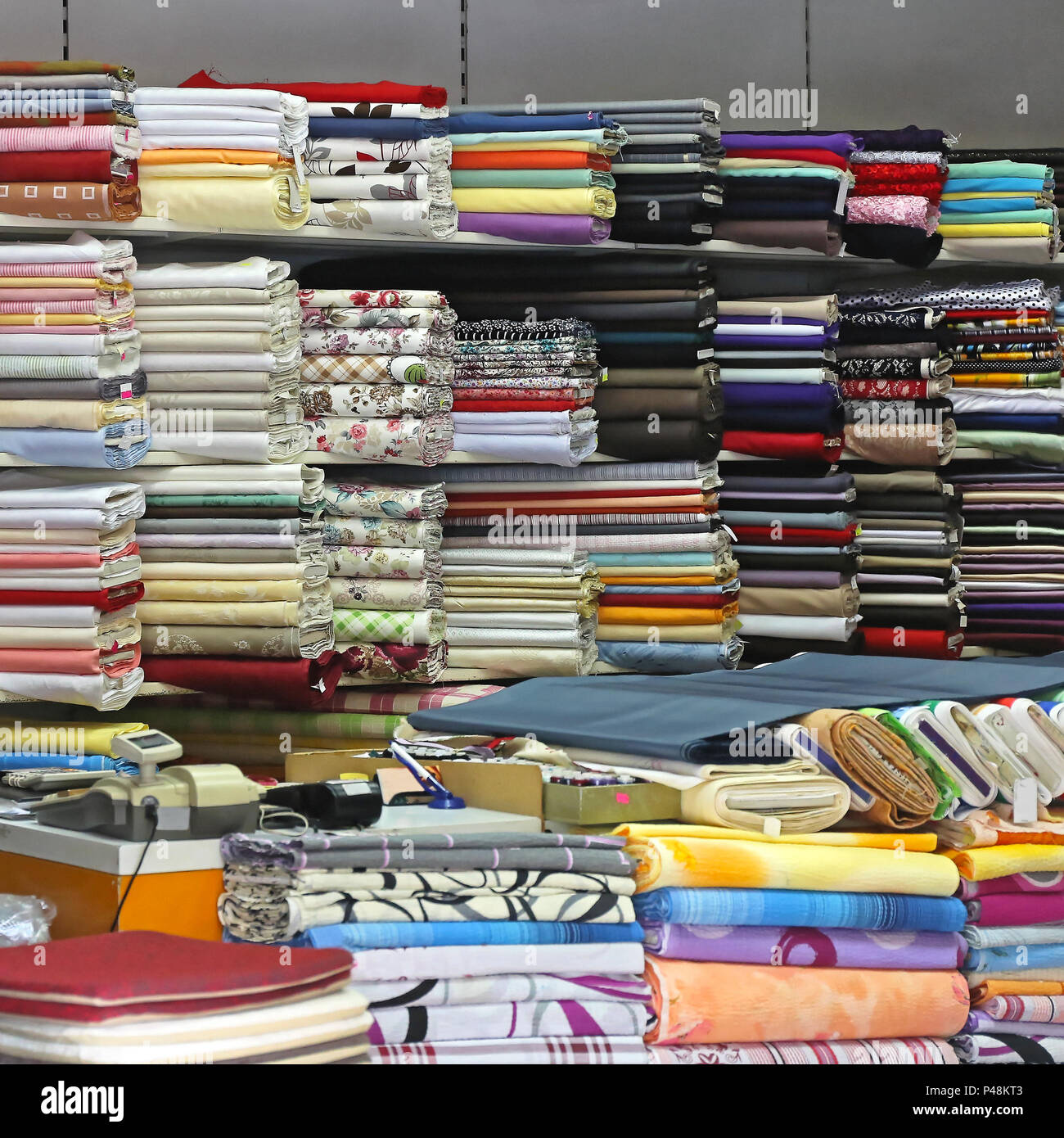 Selection of Colourful Textile Fabric Rolls at Shelf Stock Photo - Alamy