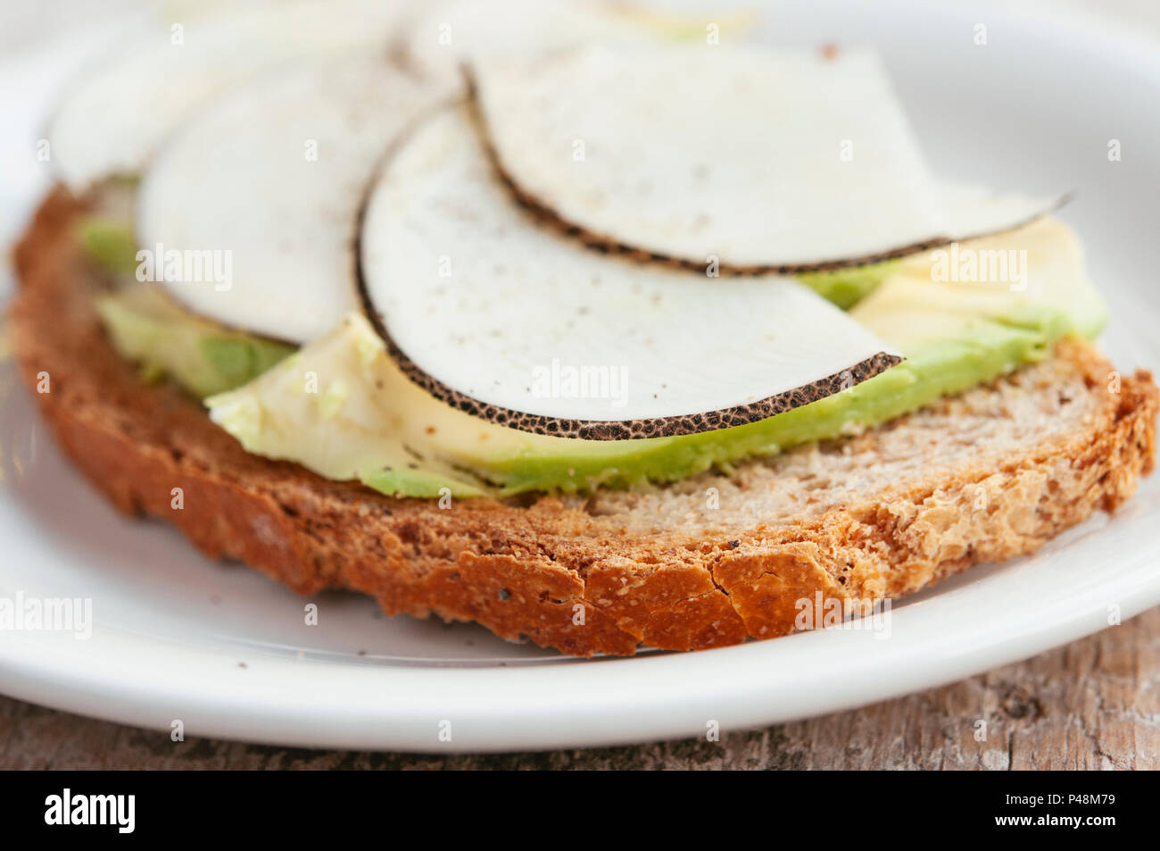 Black radish sliced and avocado on whole-grain bread Stock Photo - Alamy