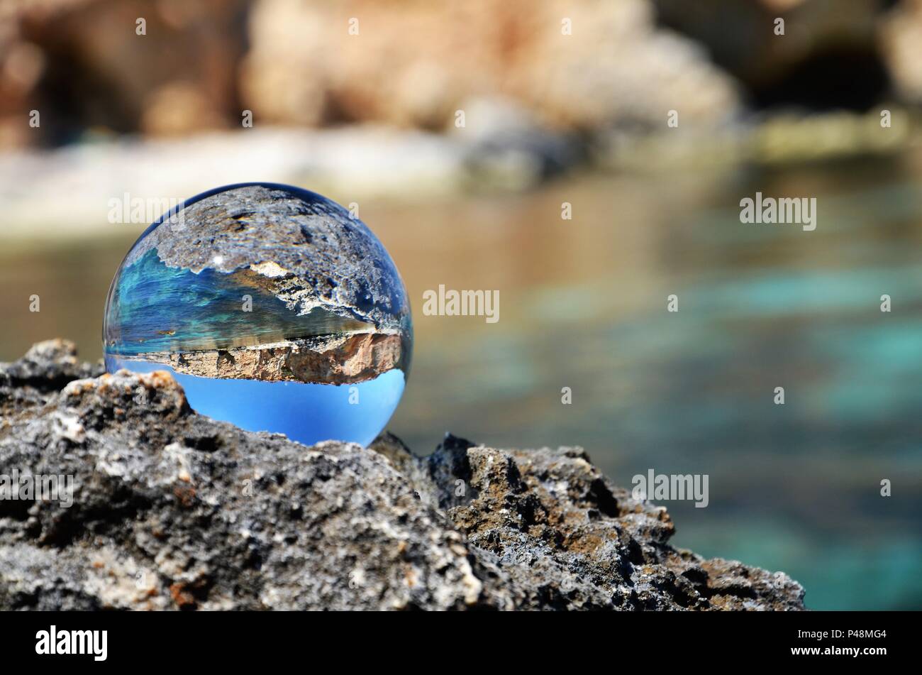 crystal glass sphere with stone rocks Stock Photo - Alamy