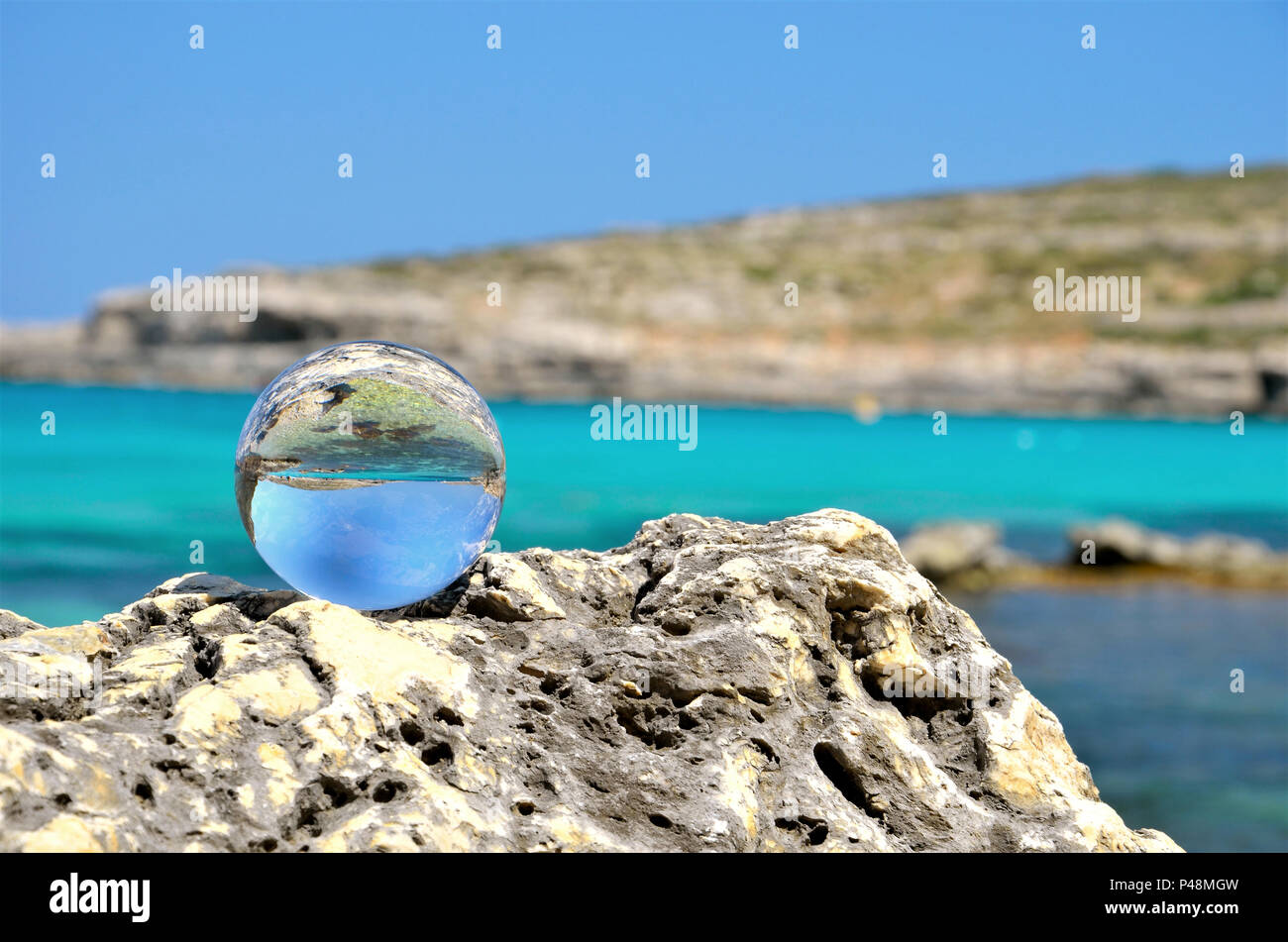 glass sphere on stone rocks Stock Photo - Alamy