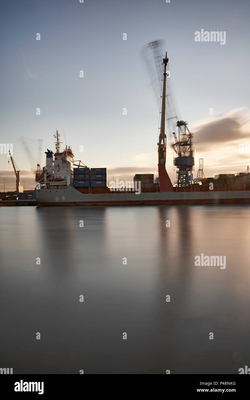 Cranes loading and unloading containerships in the international port ...