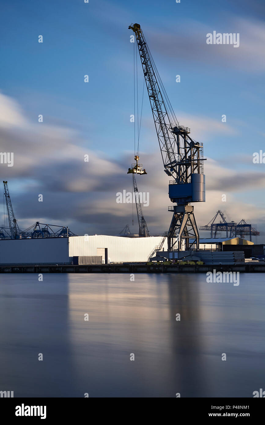 Cranes loading and unloading containerships in the international port ...