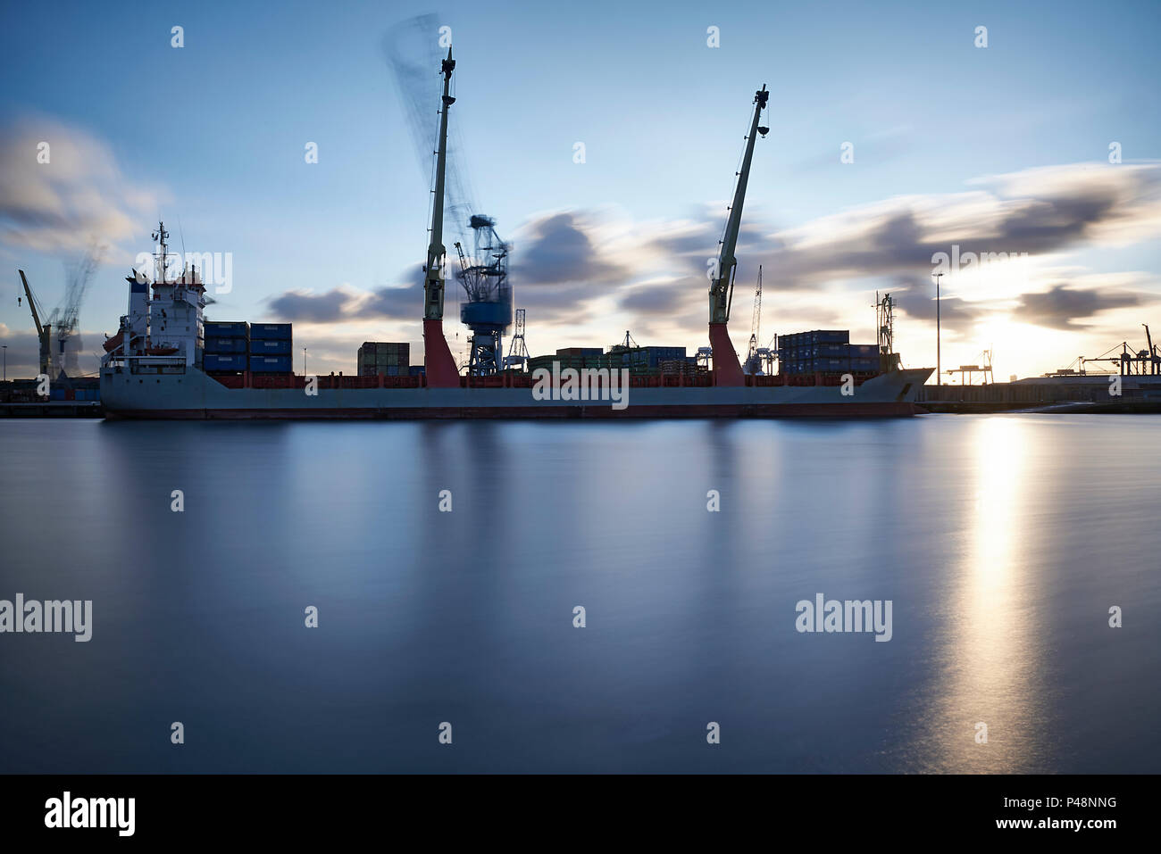 Cranes loading and unloading containerships in the international port ...