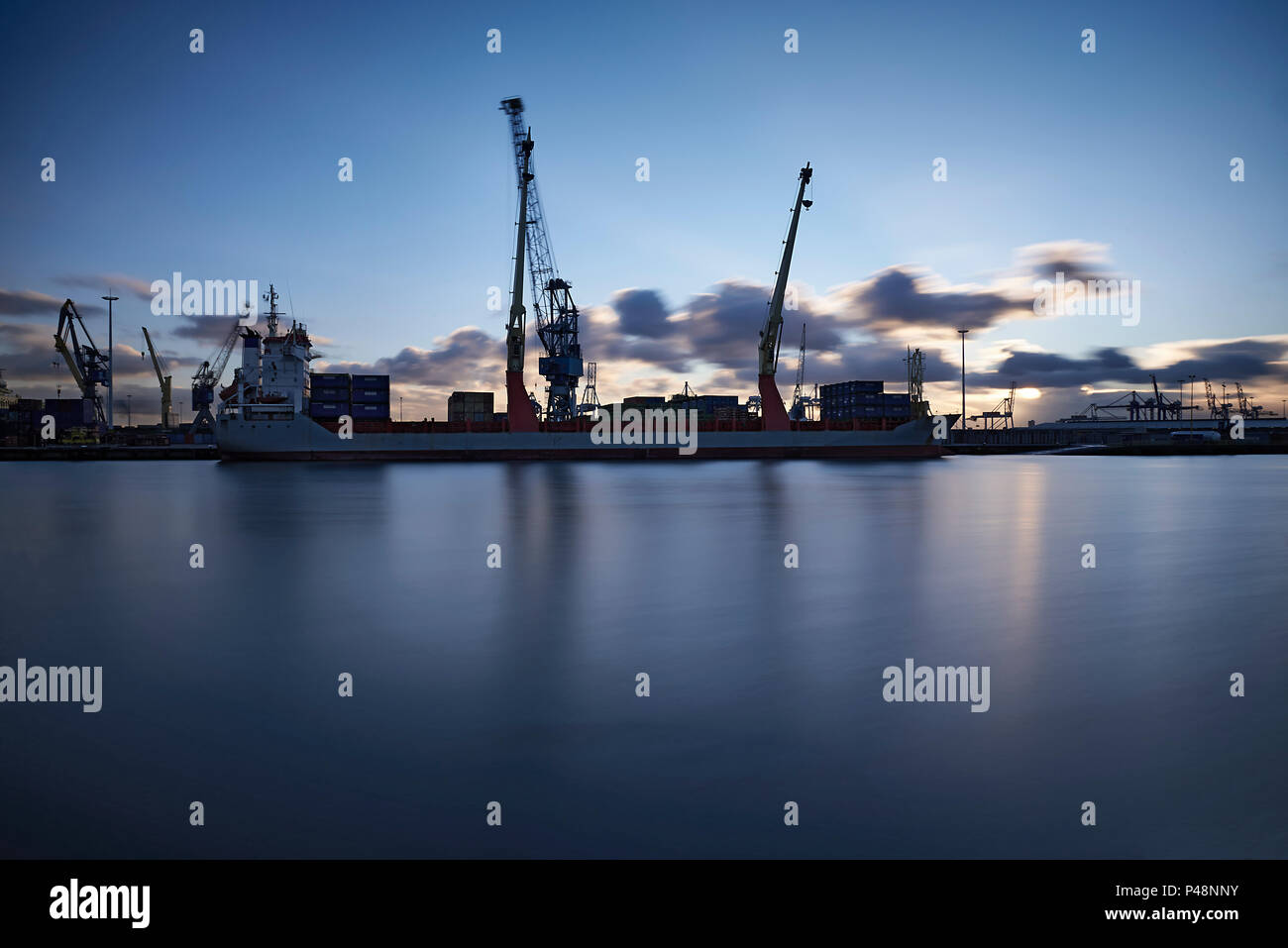 Cranes loading and unloading containerships in the international port ...