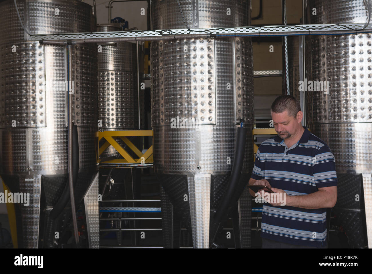 Male worker using digital tablet Stock Photo - Alamy