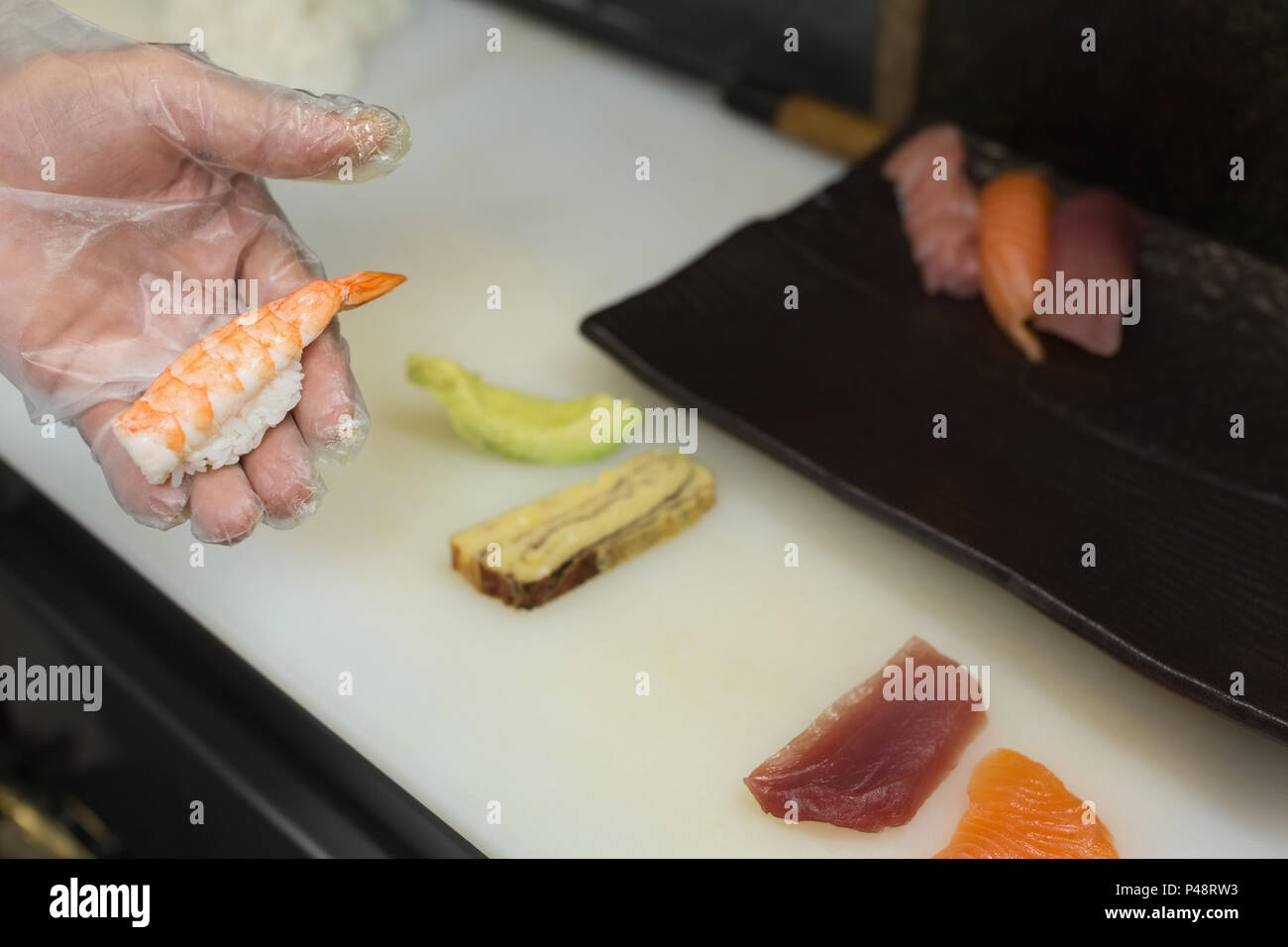 Chef holding sea food in kitchen Stock Photo - Alamy