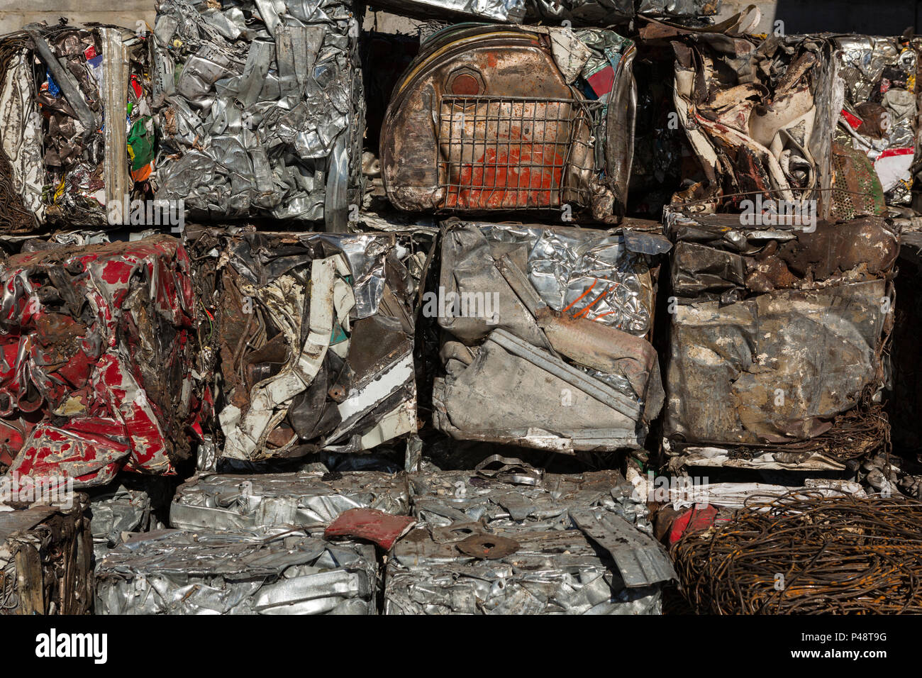 Compressed trash in scrapyard Stock Photo - Alamy