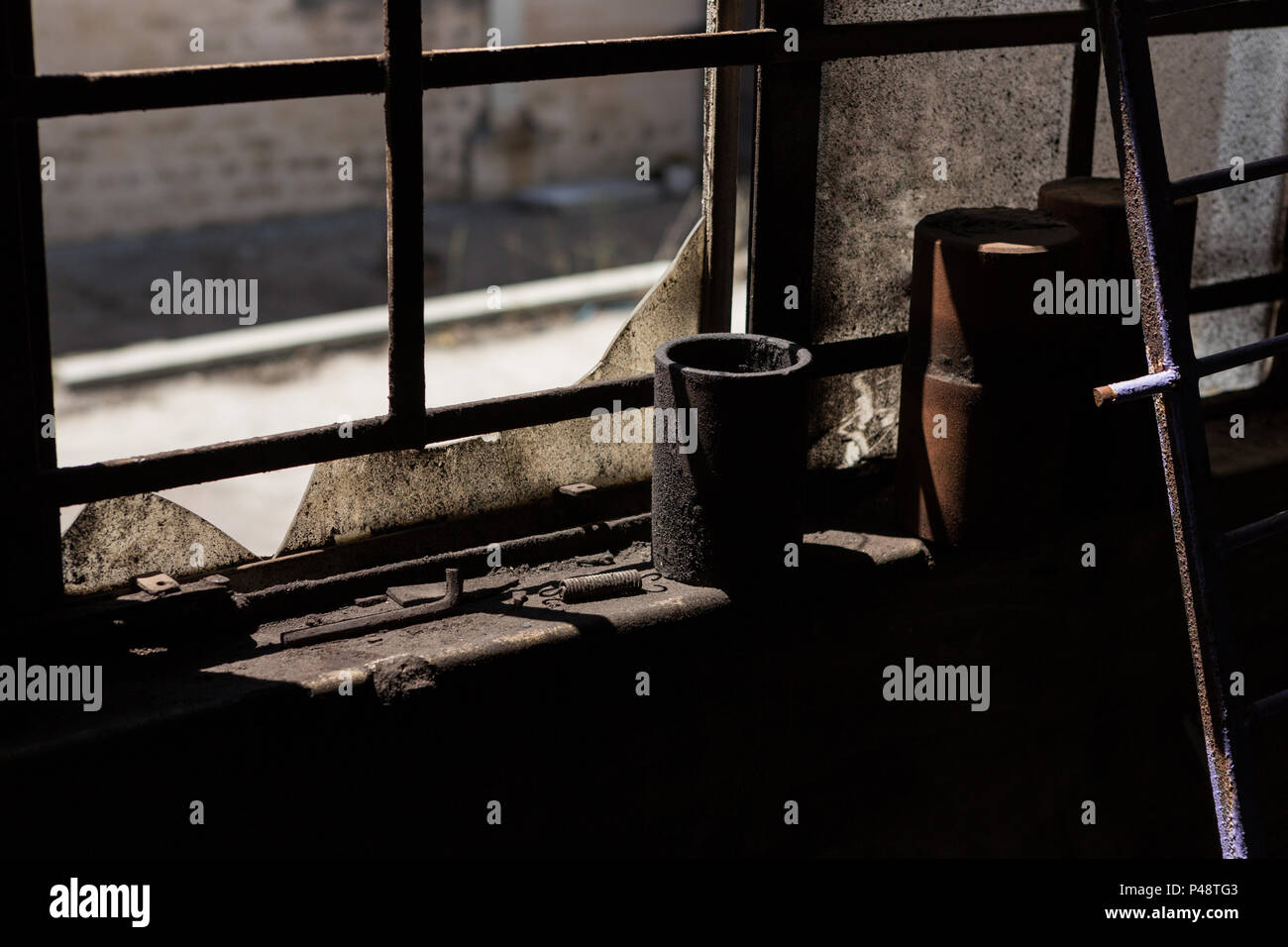 Two rusty containers kept on the window sill Stock Photo - Alamy