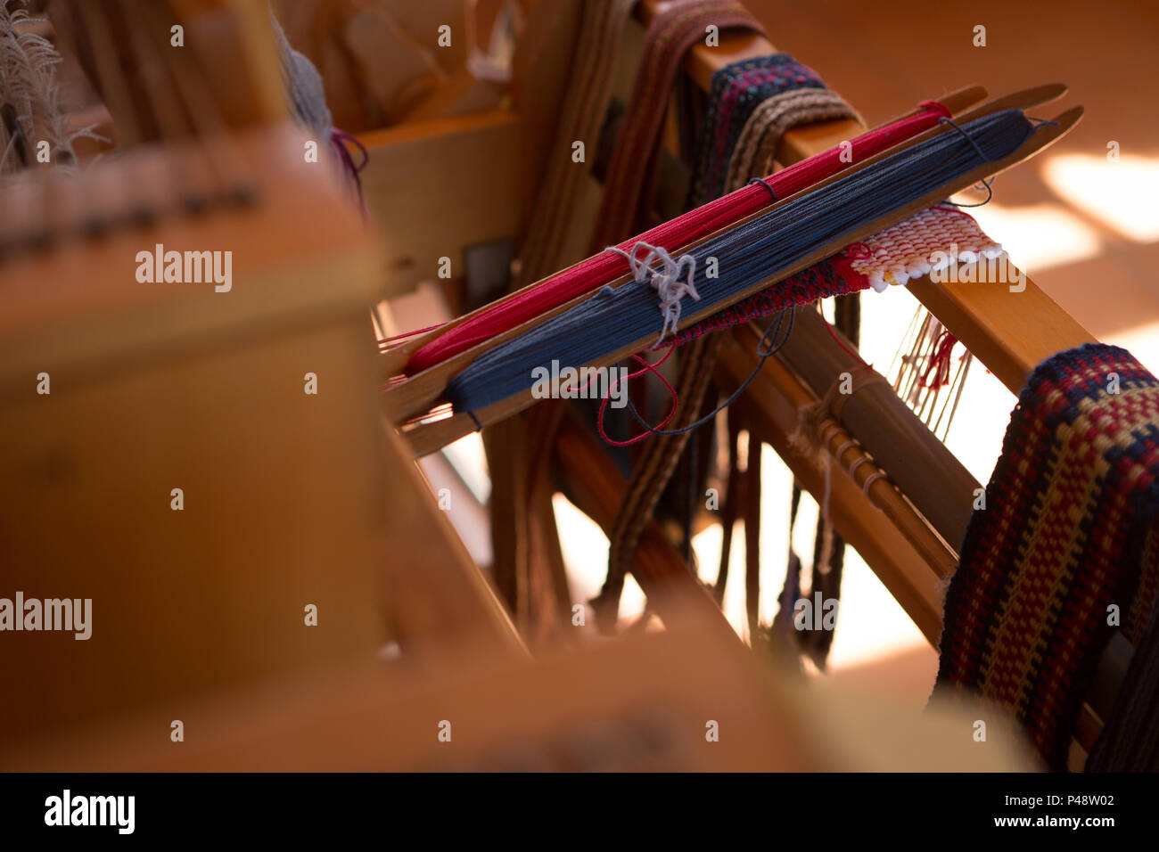Machine with silk thread in factory Stock Photo - Alamy