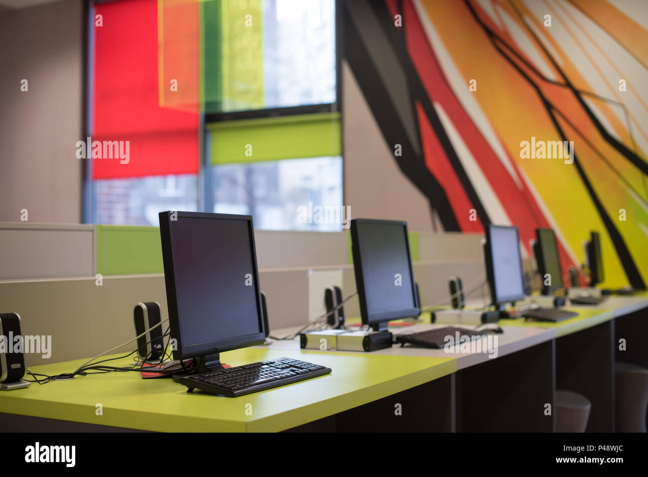 Desktop pc in library Stock Photo - Alamy