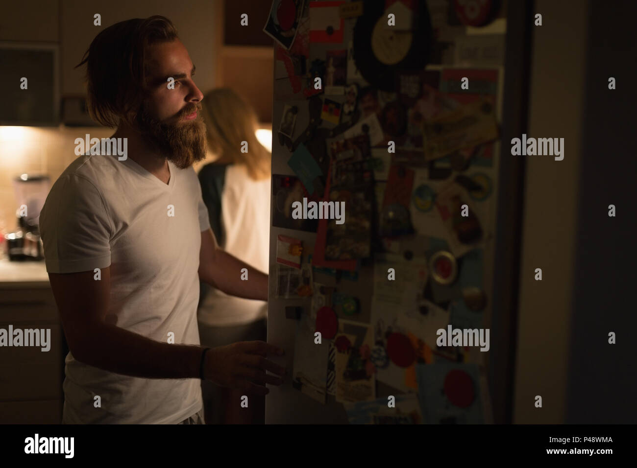 Man opening fridge hi-res stock photography and images - Alamy