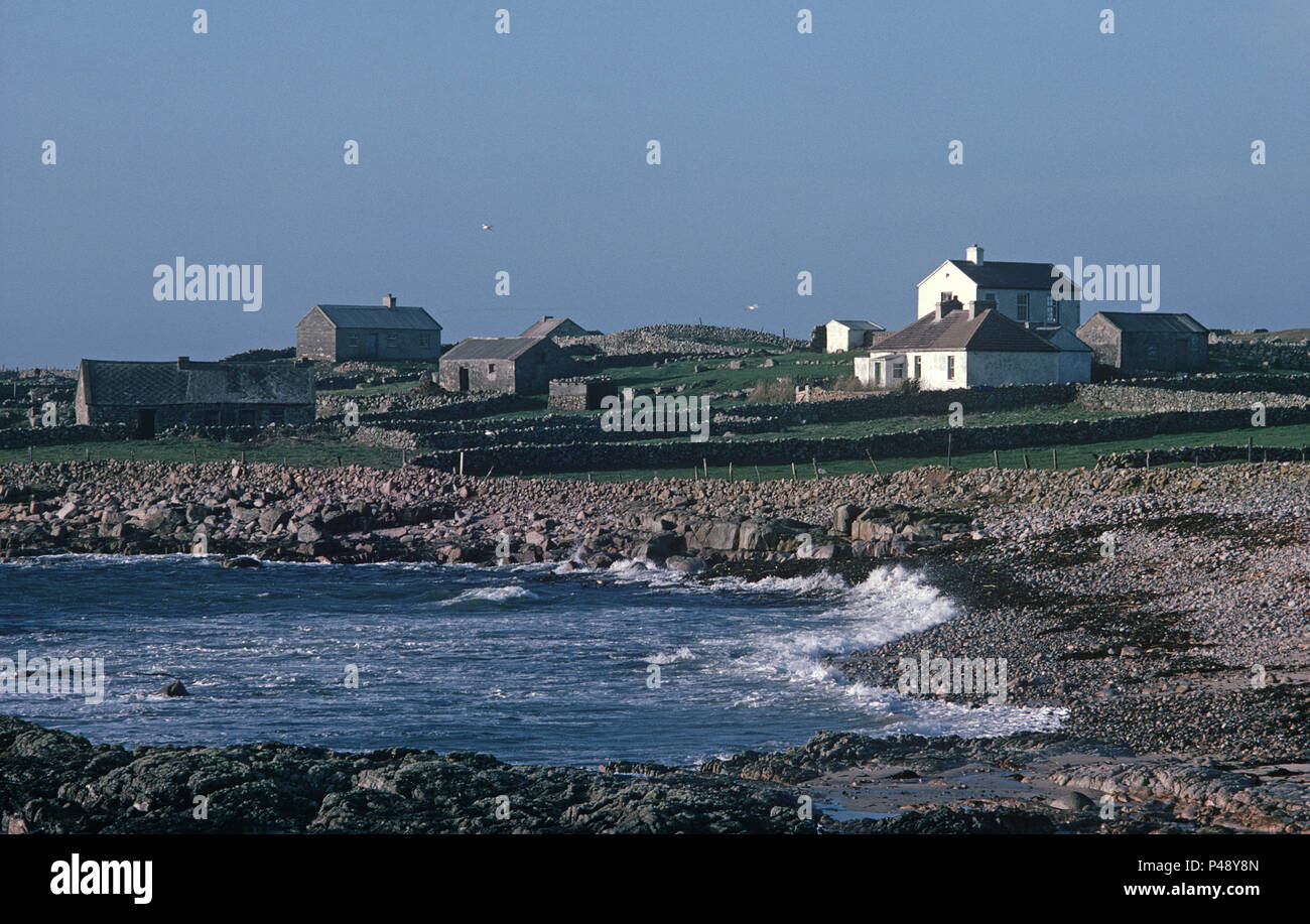 Stone cottage ruins and occupied cottages on Inishturbot Island ...