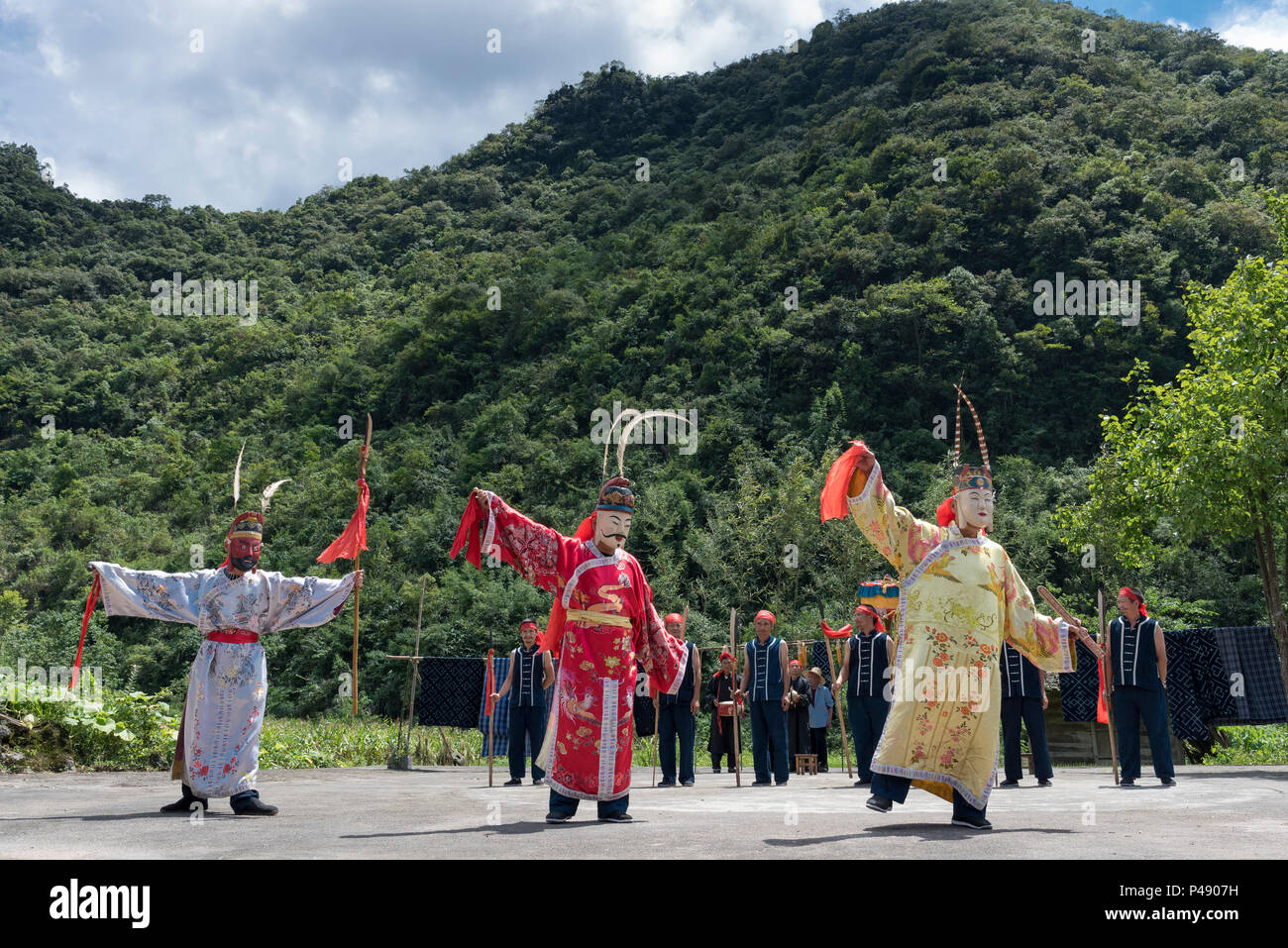 Costumed performer in Buyi opera, Buyi ethnic minority village, Li Feng ...