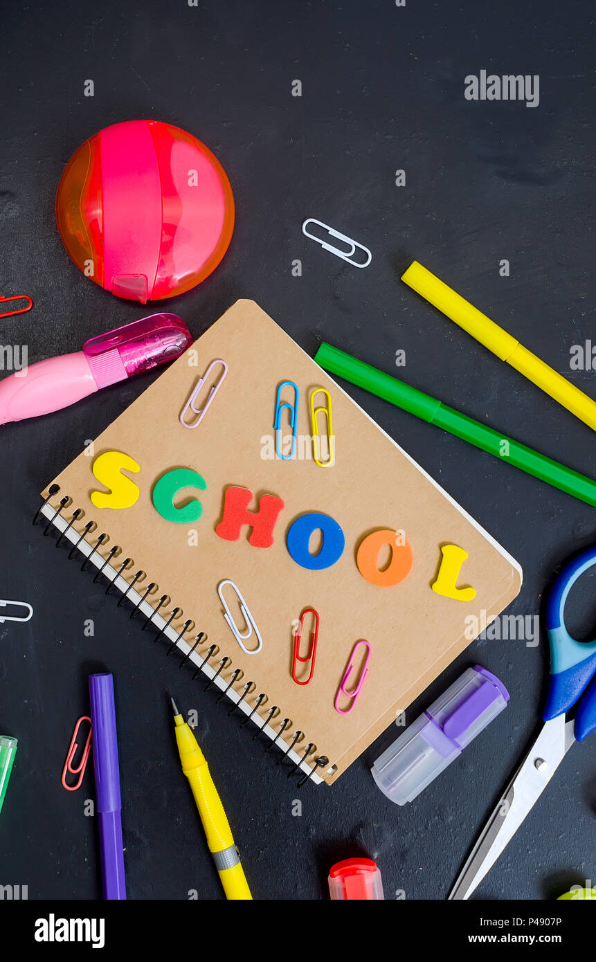 Flat lay with lettering back to school and set of school equipment on ...