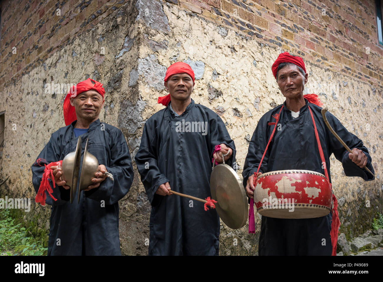 Costumed performers play cymbals and drum in Buyi opera, Buyi ethnic ...