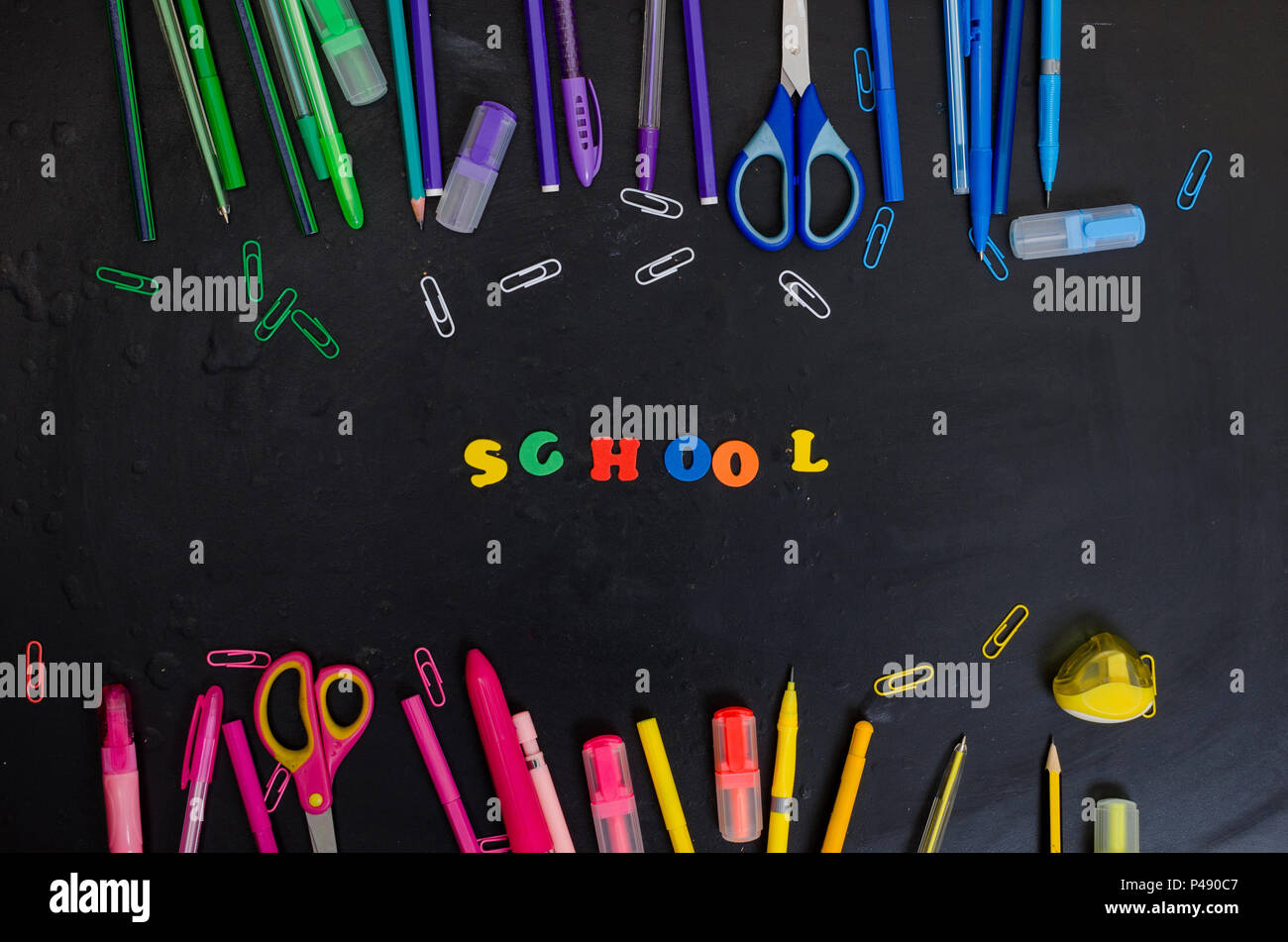 Flat lay with lettering back to school and set of school equipment on ...