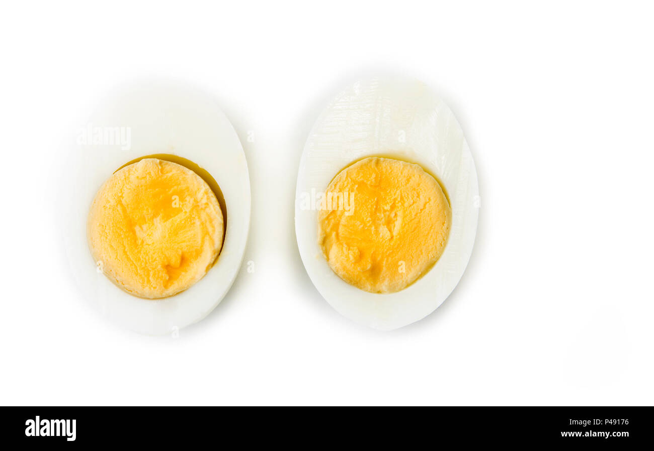 Hard boiled egg cut in halves on the white Stock Photo - Alamy