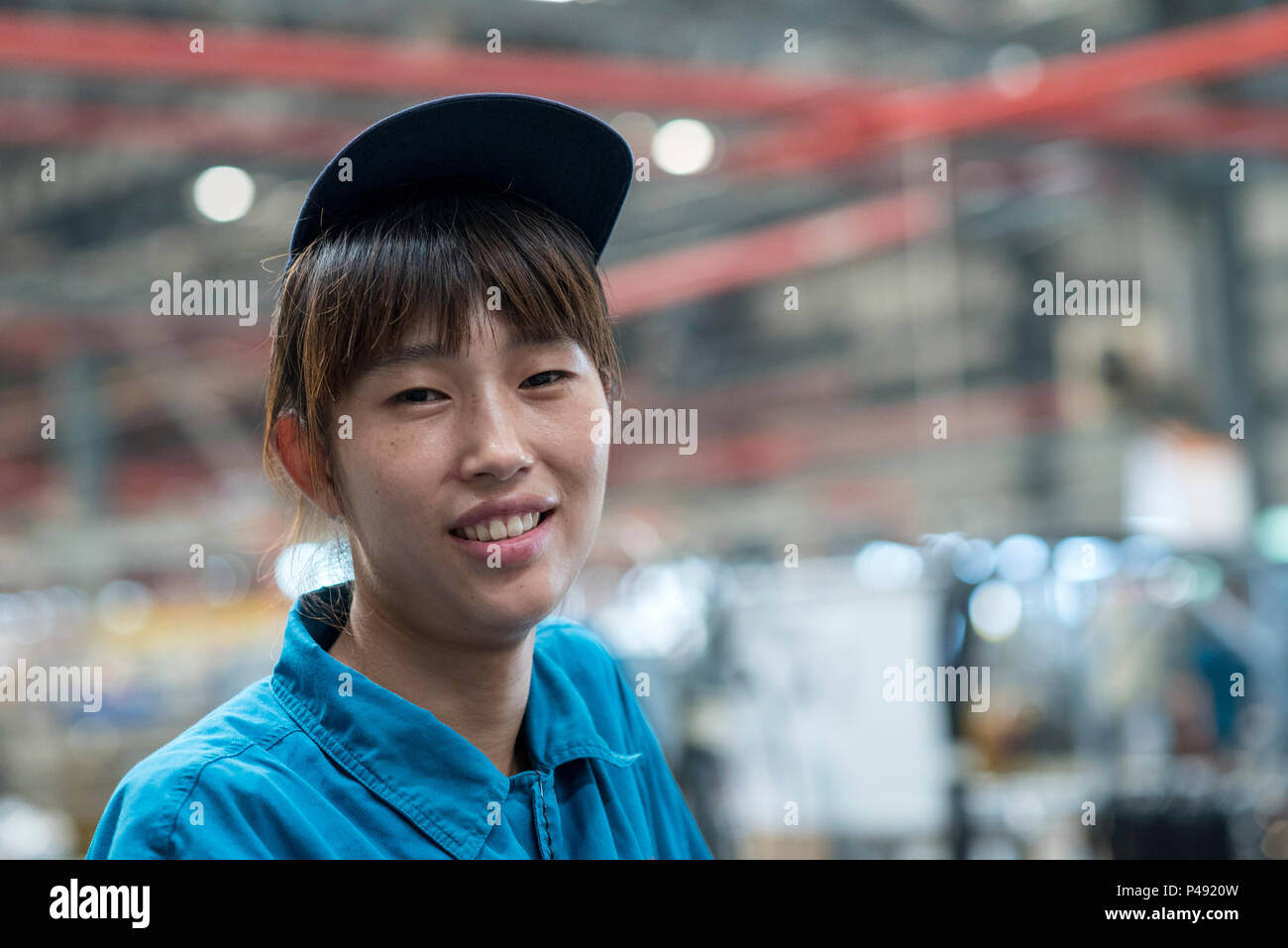 Assembly line workers at China National Heavy Duty Truck Group, Jinan ...