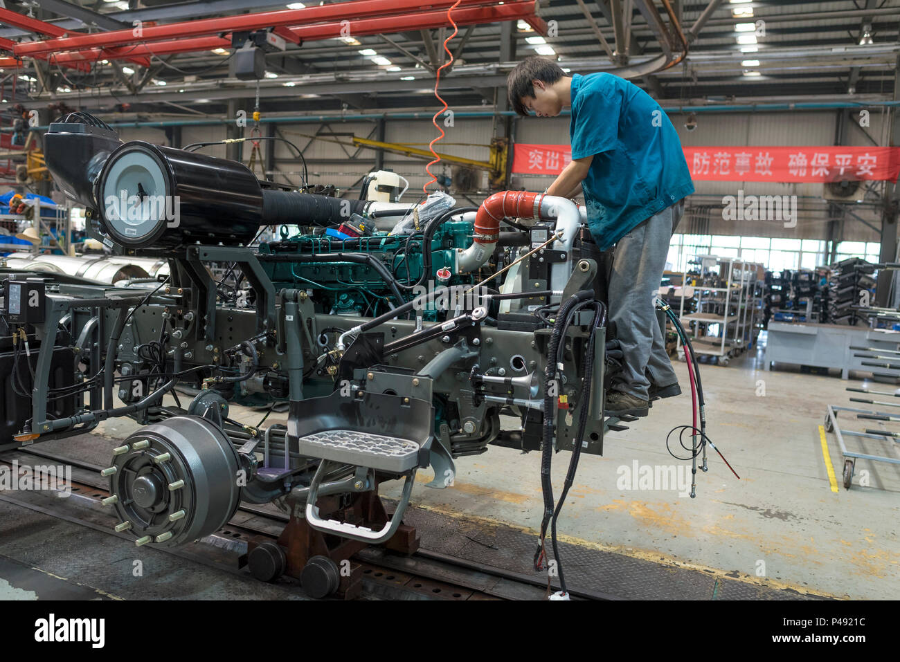 Assembly line worker at China National Heavy Duty Truck Group, Jinan ...