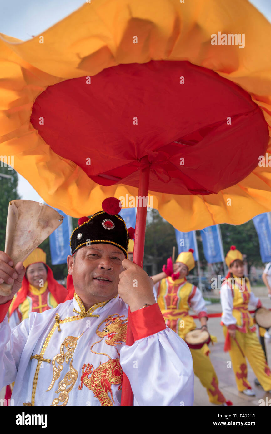 Costumed performers at conference opening ceremony Quancheng Square ...