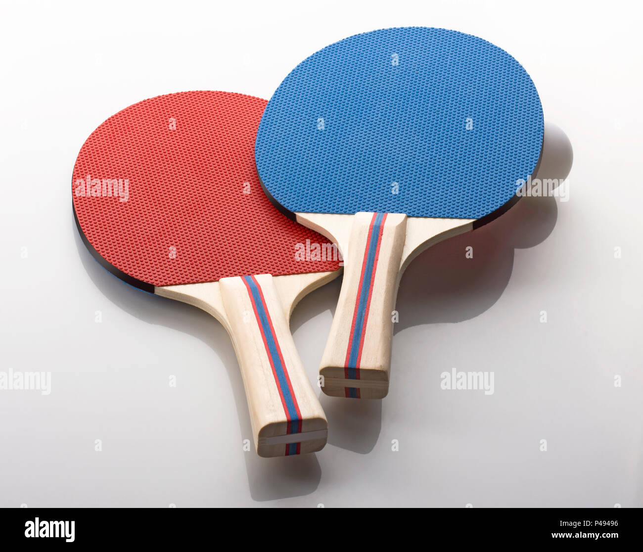 Red and Blue Ping Pong Paddles with reflection, Handles Facing Camera ...