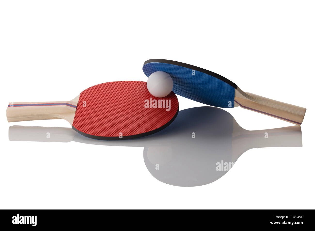 Ball in between two ping pong paddles, showing entire paddle, on white ...