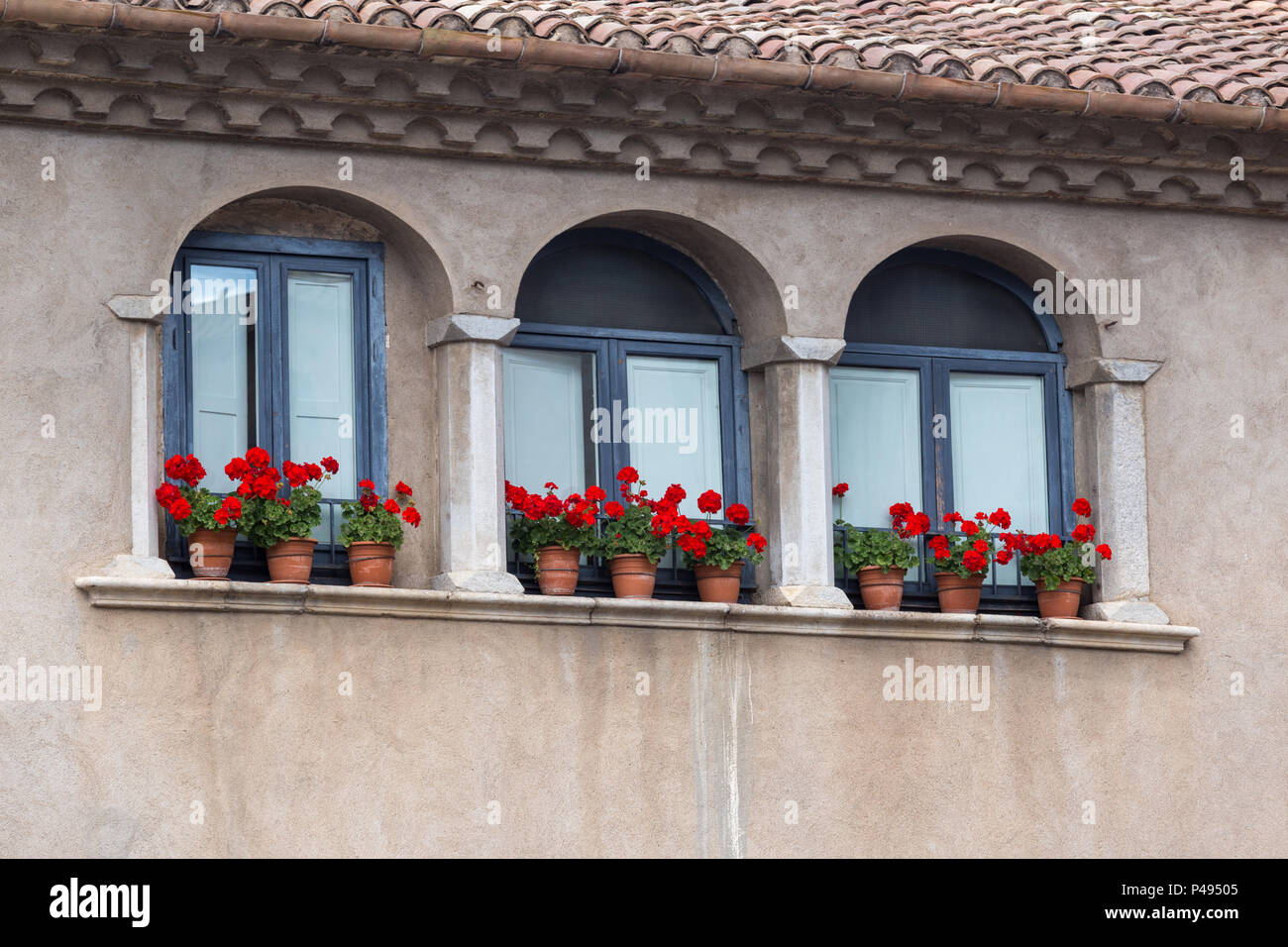 Nice windows with geranium flowers in a spanish town Gerona Stock Photo ...
