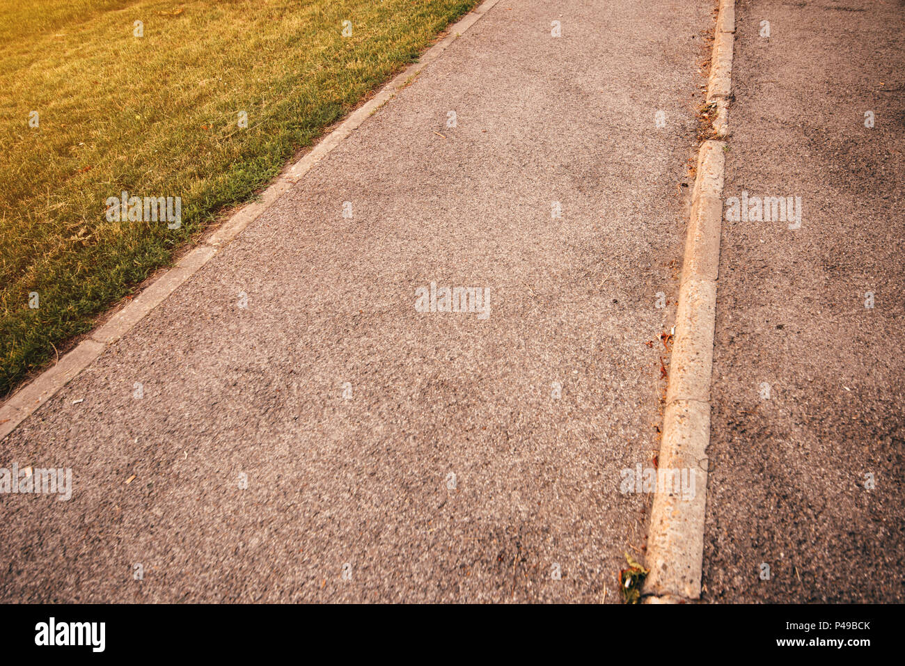 Urban asphalt empty bicycle lane in diminishing perspective Stock Photo ...