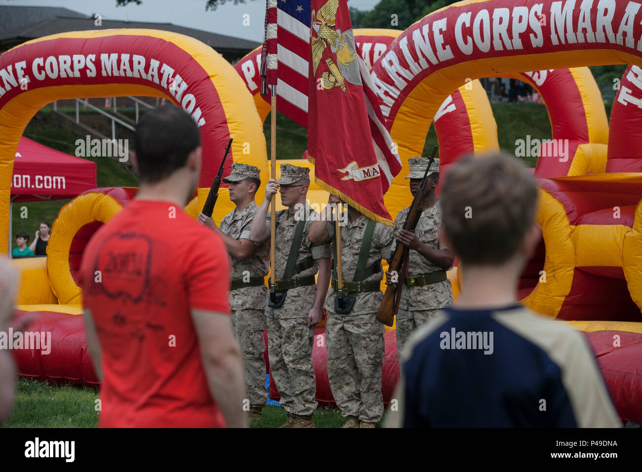 Marine color guard present arms during the Marine Corps Marathon (MCM ...