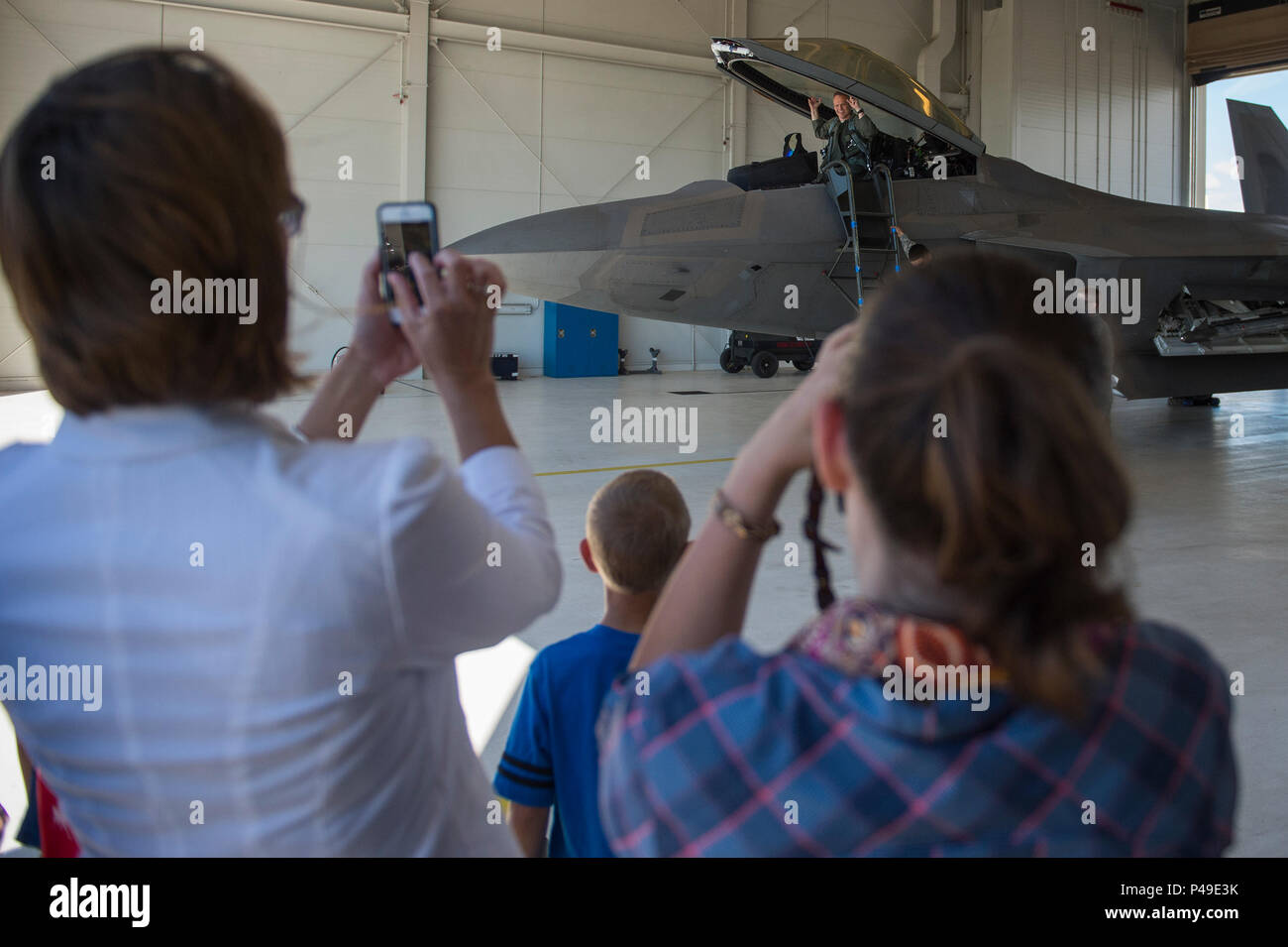 U.S. Air Force Col. Charles Corcoran's family takes photos after he ...