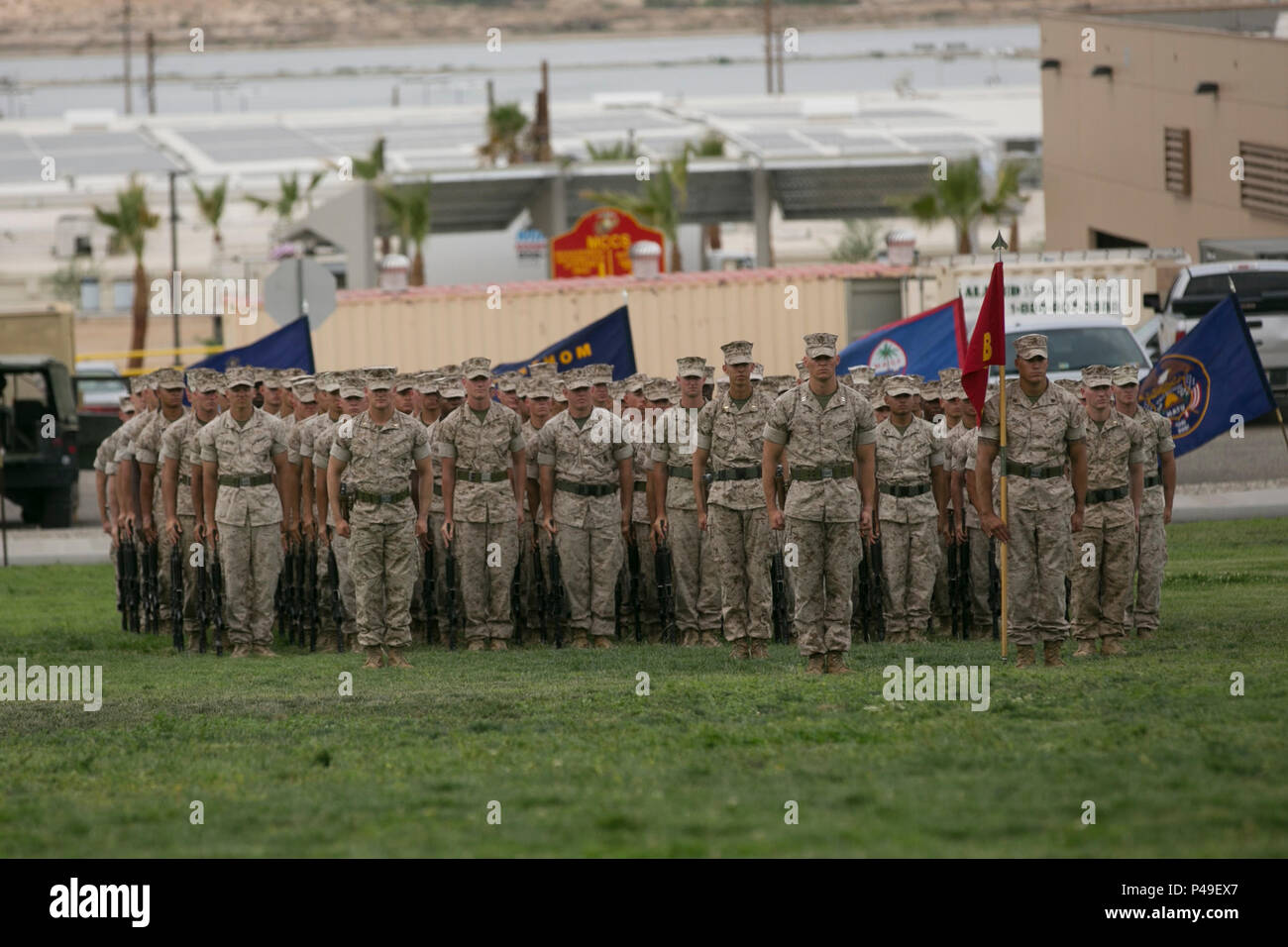 Marines of 1st Battalion, 7the Marine Regiment stand at the position of ...