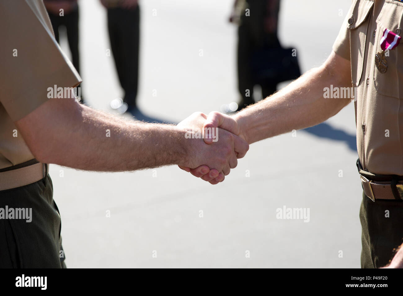 U.S. Marine Corps Lt. Col. Joel M. Hoffman, right, outgoing commanding ...