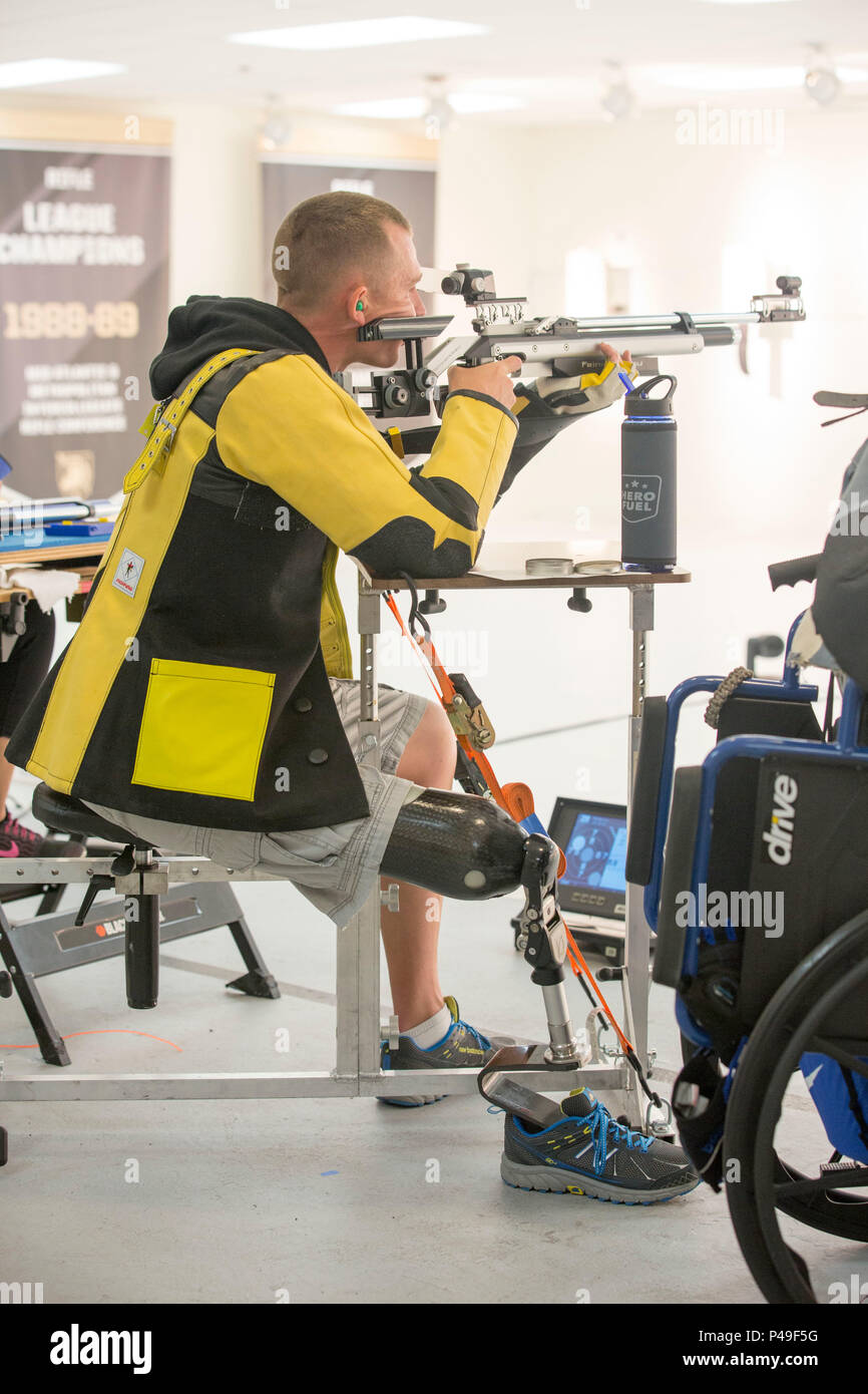 U.S. Army Veteran Sgt. 1st Class Allan, of Fort Hood, Texas, fires an ...